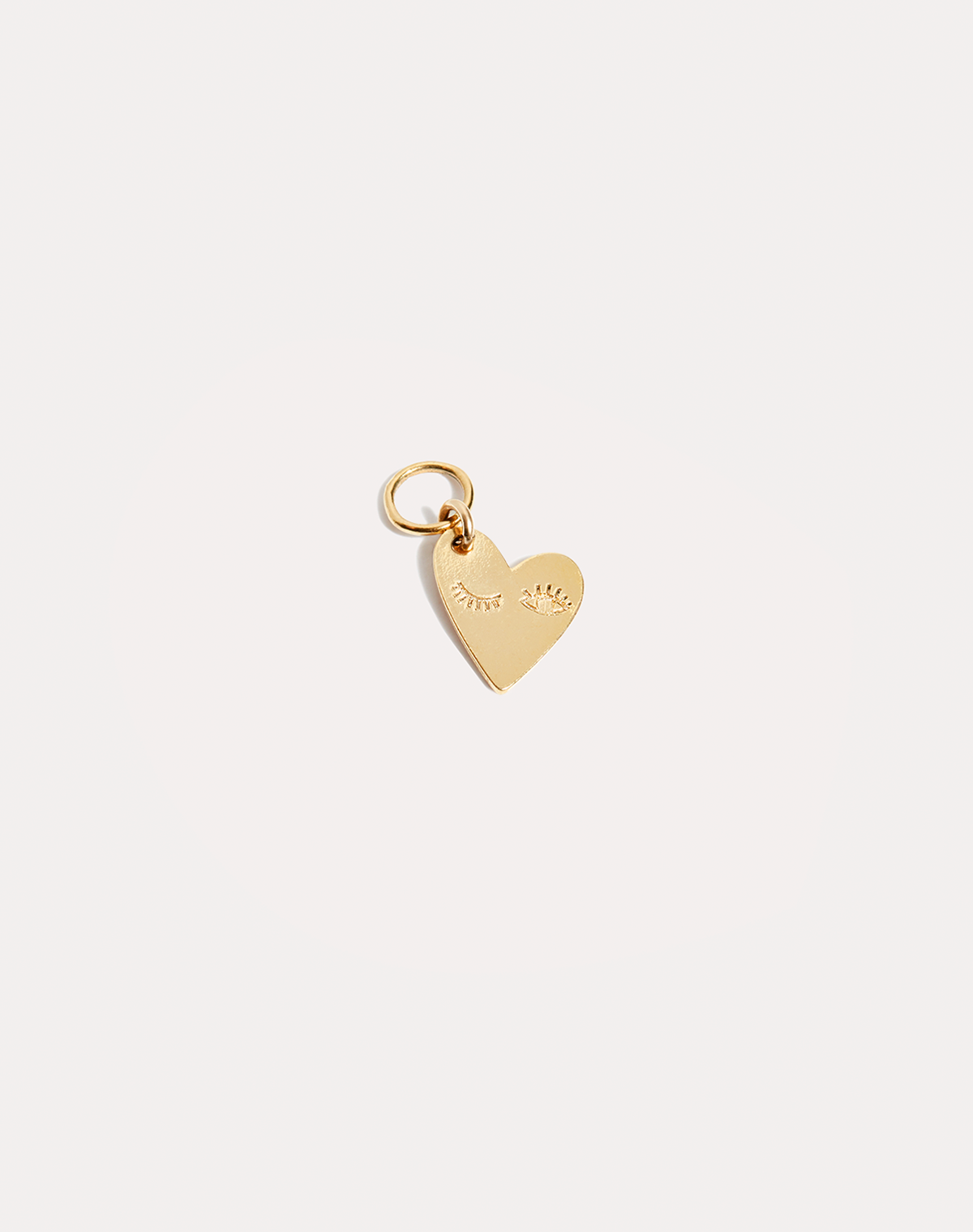 Earring with dainty gold winky eye heart charm – NUE Hoops